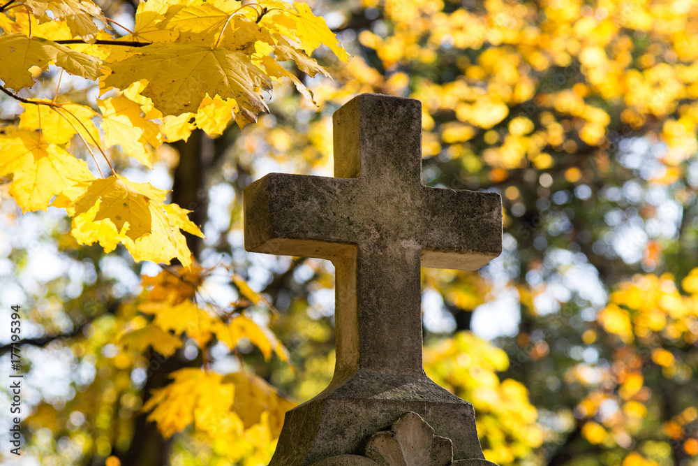 Old stone memorial cross at cemetery. Religious Christian symbol on ...
