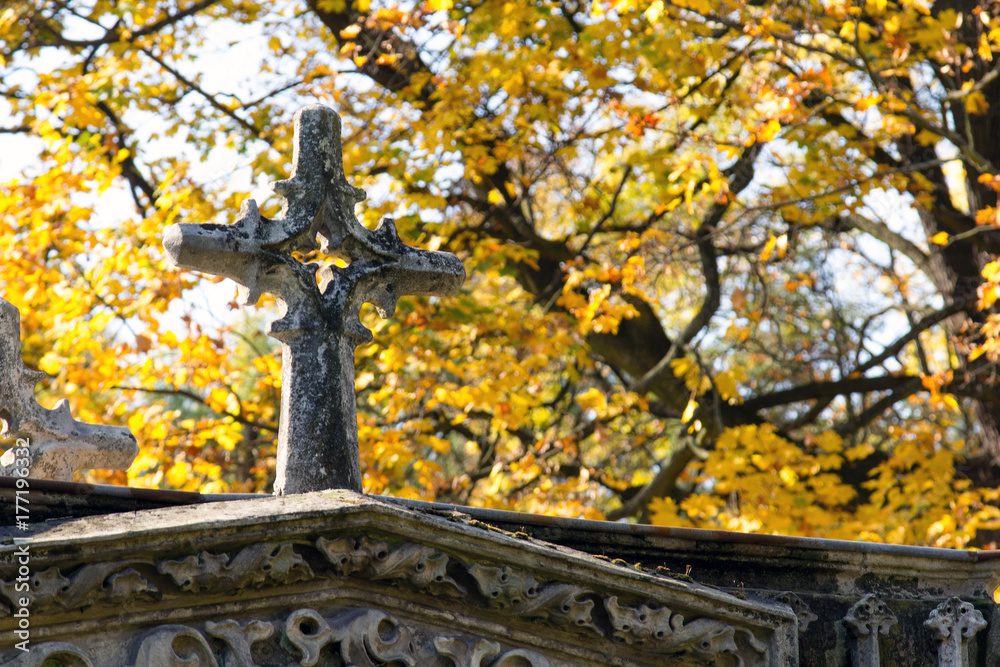 Old stone memorial cross at cemetery. Religious Christian symbol on ...