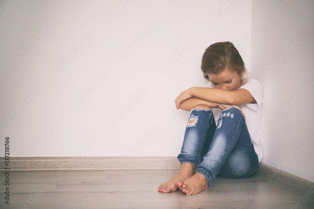 Scared little girl sitting in corner. Domestic violence concept Stock ...