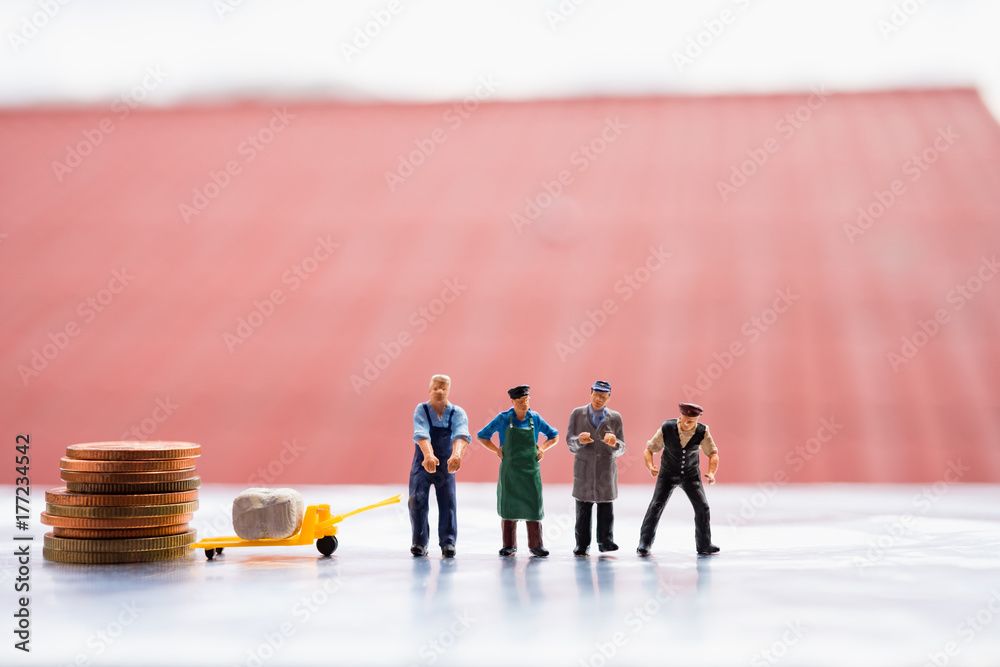 Miniature people, logistic team with cargo and coin at work site, using ...