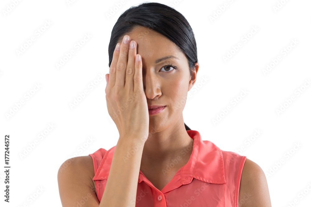Woman covering her eye with hand against white background Stock Photo ...