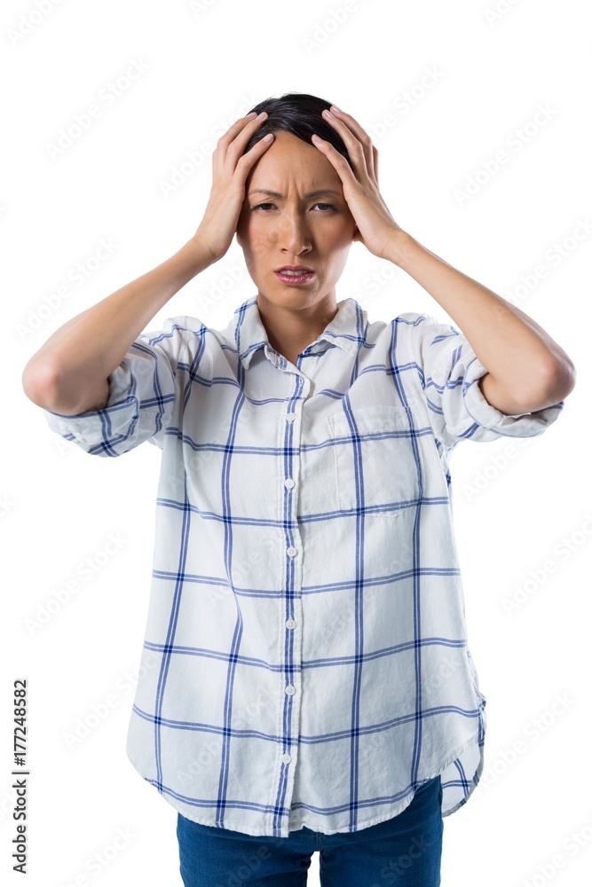 Worried woman standing against white background Stock Photo | Adobe Stock