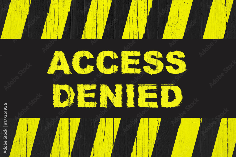 Access denied warning sign with yellow and black stripes painted over ...
