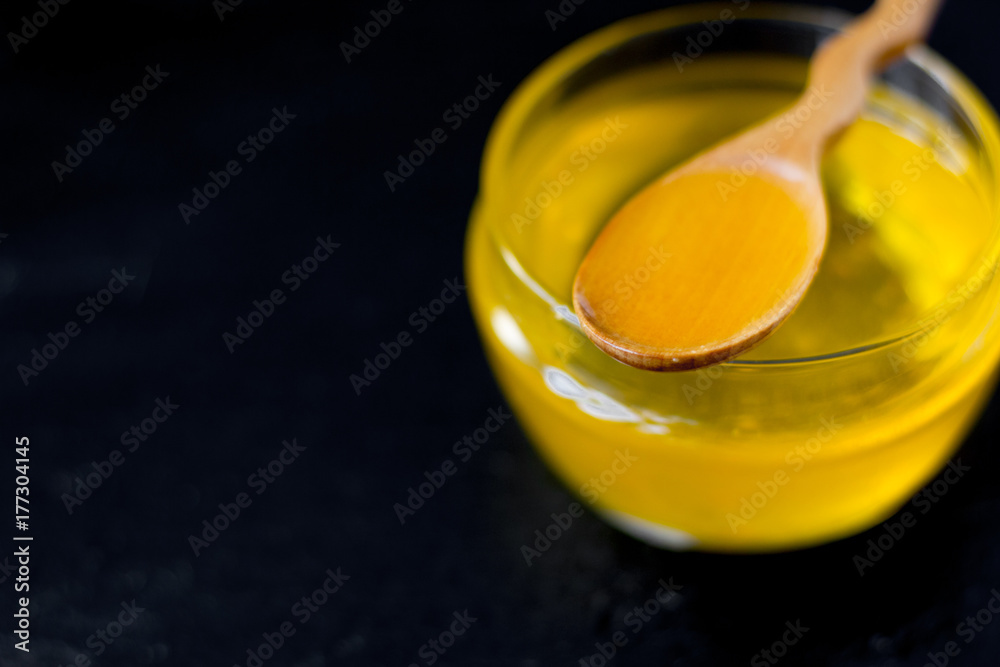 Indian ghee in a transparent glass bowl. Stock Photo | Adobe Stock
