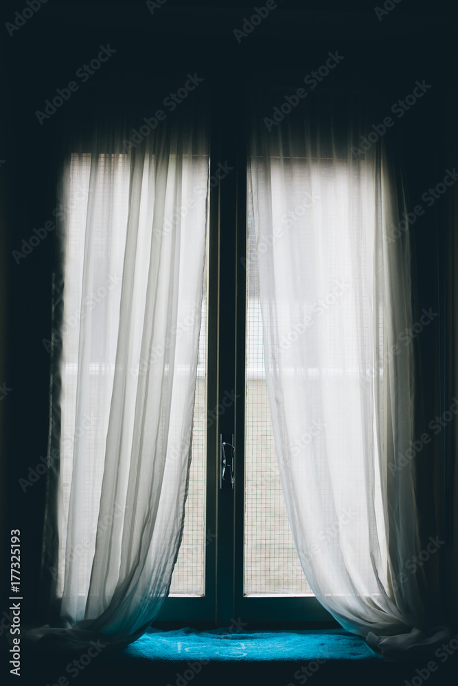 Light coming inside dark room from window with curtains Stock Photo ...