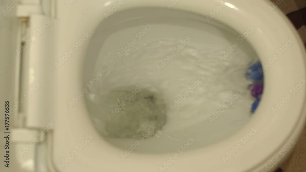 Toilet bowl with running water. Flush clean wc, water splash in toilet ...