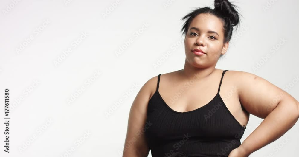 Strong confident beautiful plus size African American model in black ...