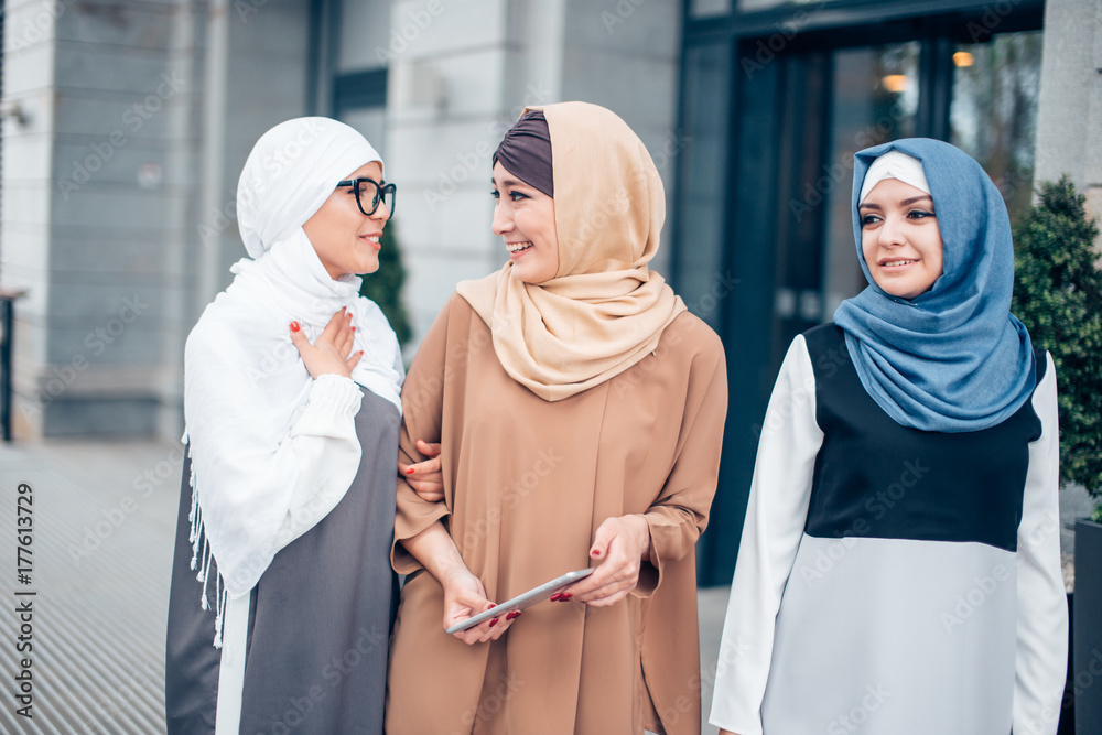 Three Muslim Female Friends Walking Stock-Foto | Adobe Stock