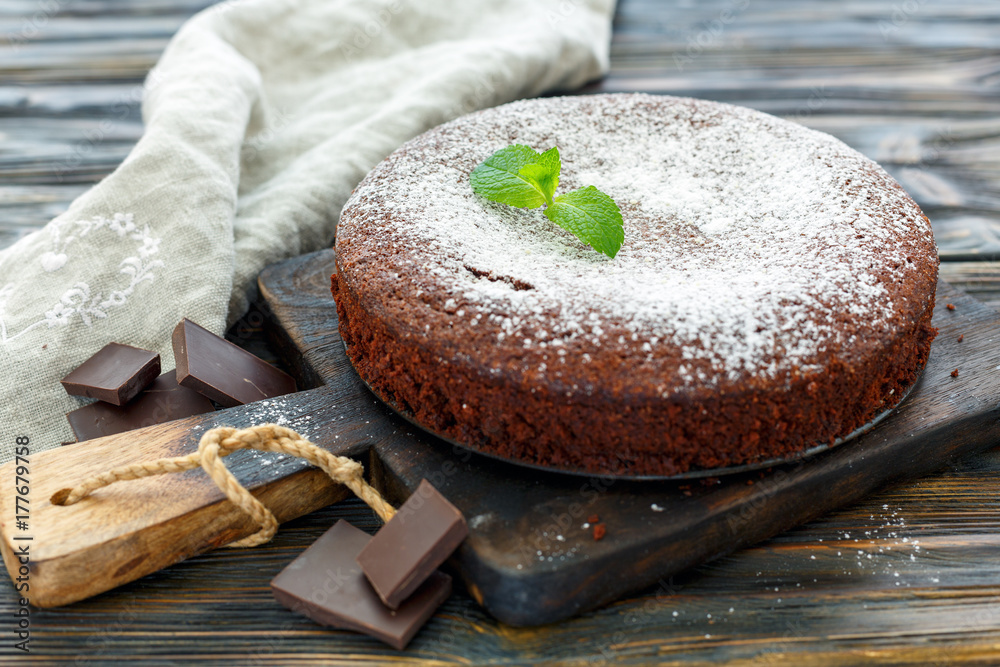Delicious chocolate cake,dusted with powdered sugar. Stock Photo ...
