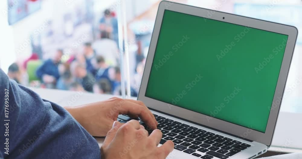 Man hands using laptop close-up table office public space people blur ...