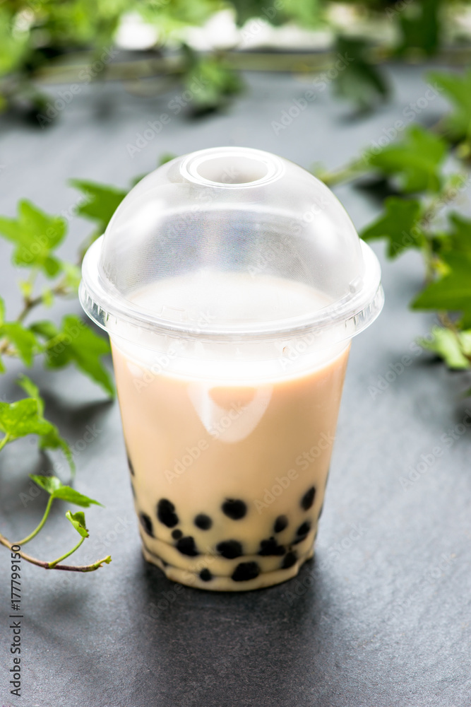 Bubble boba tea with milk and tapioca pearls in plastic cup Stock Photo ...