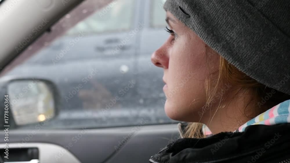 Sad girl the passenger is traveling in the car. slowmotion, HD ...