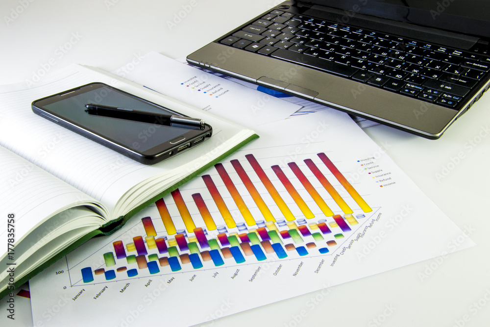 Preparing report. Blue graphs and charts. Business reports and pile of ...