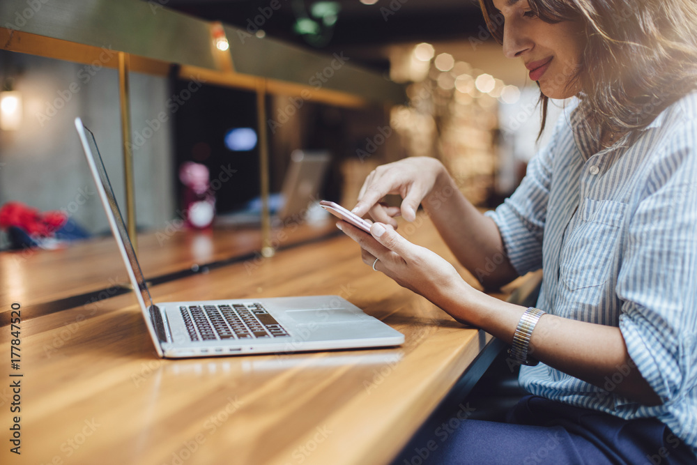 Business woman pointing finger on screen smart phone while working in ...