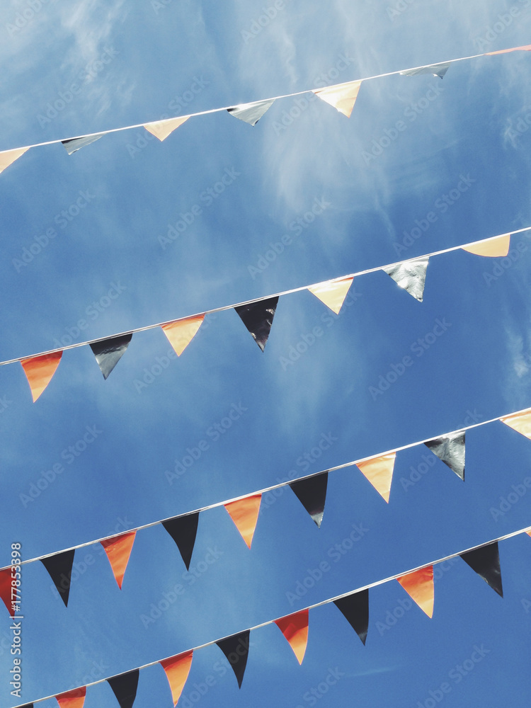 Colorful flags extending across blue sky Stock Photo | Adobe Stock