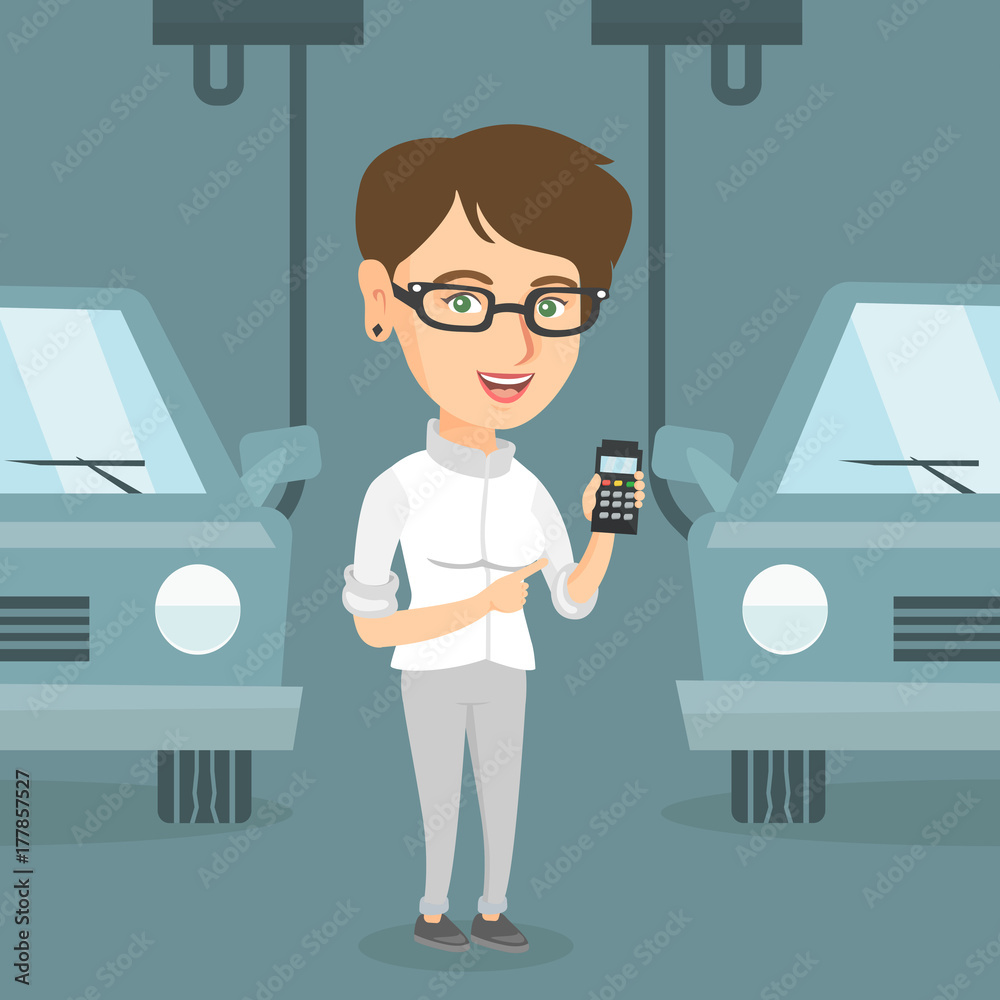 Young caucasian worker of car factory controlling automated assembly ...