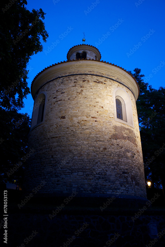 Rotunda chapel at night / Illuminated romanesque circular church in ...