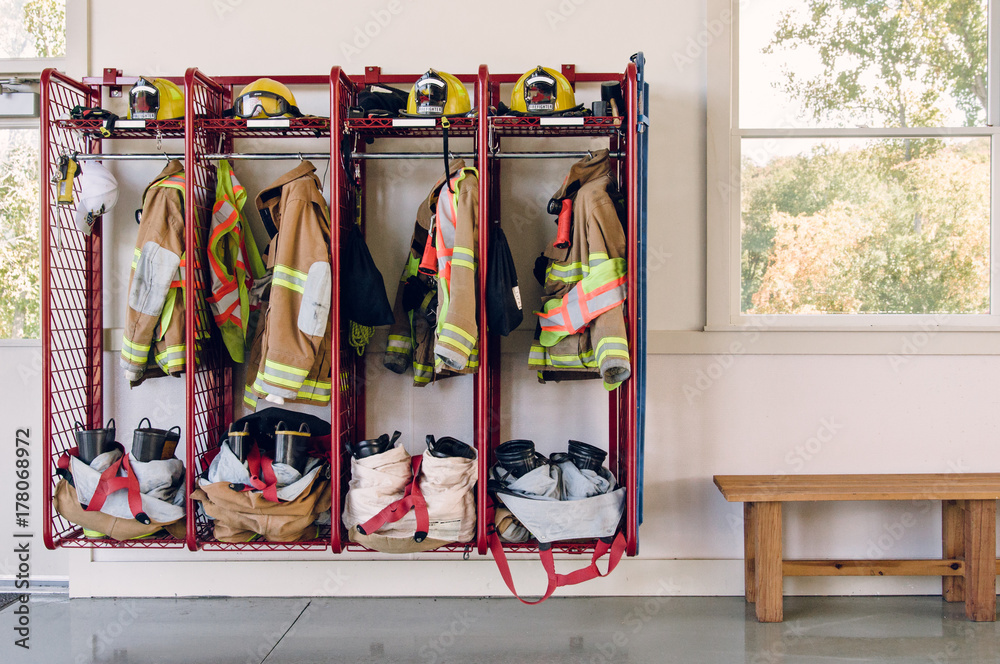 firefighters' uniforms inside a firehouse Stock Photo | Adobe Stock