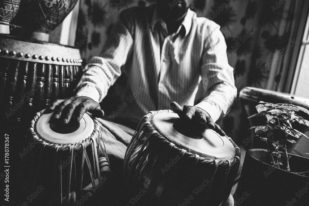 Indian man playing traditional indian drums Stock Photo | Adobe Stock