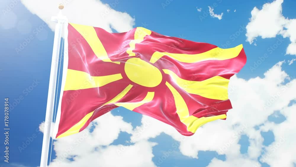 Realistic flag of Macedonia waving against time-lapse clouds background ...
