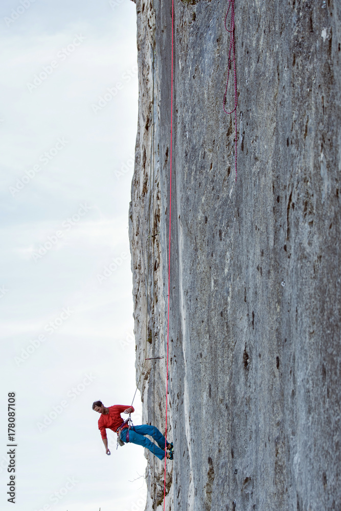 A mountain climber is hanging on the wall of the one of the Barmsteine ...