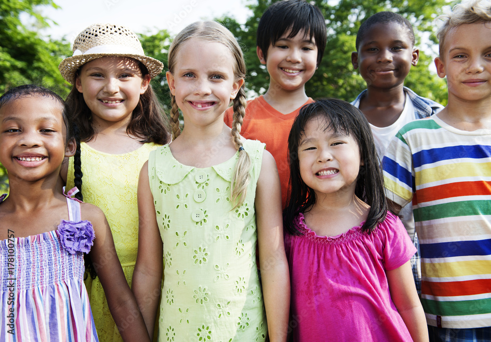 Cute diverse kids playing in the park Stock Photo | Adobe Stock
