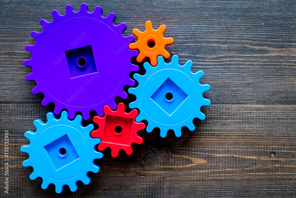 colorful gears for ideal team work technology wooden table background ...