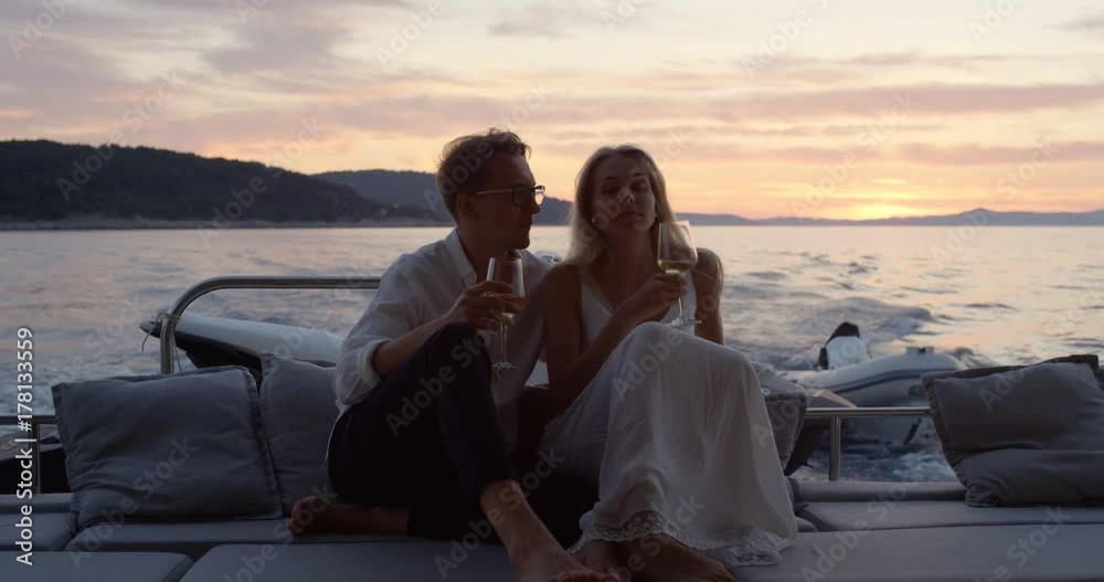 Young Couple Hug, Drink Champagne in the Stern of the Moving Yacht ...