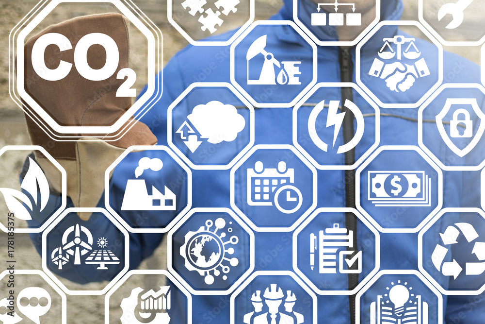 Industrial worker using virtual touchscreen presses CO2 text button ...