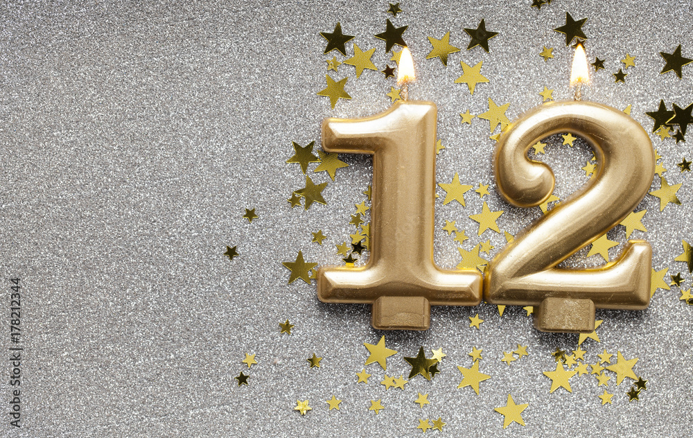 Number 12 gold celebration candle on star and glitter background Stock ...