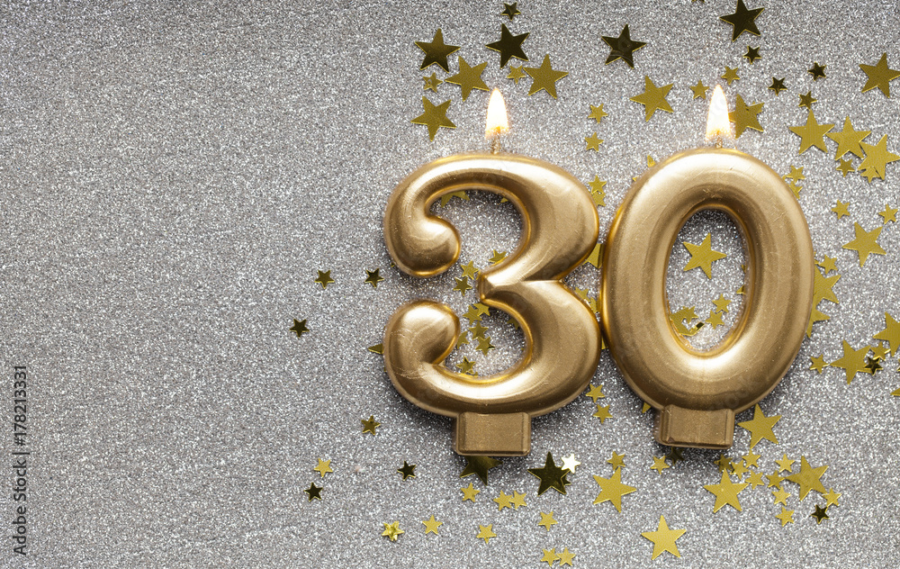 Number 30 gold celebration candle on star and glitter background Stock ...