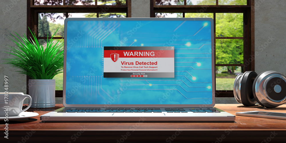Laptop with virus detected screen on wooden desk at home. Beautiful ...