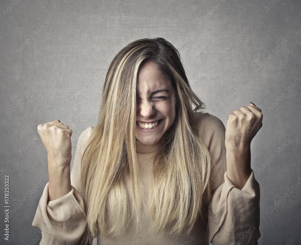 Successful girl exulting Stock-Foto | Adobe Stock