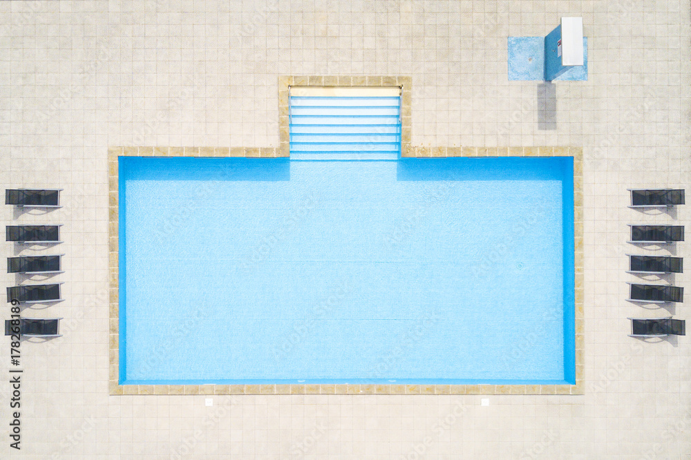 Aerial view of empty swimming pool with shower outdoors. Beautiful pool ...