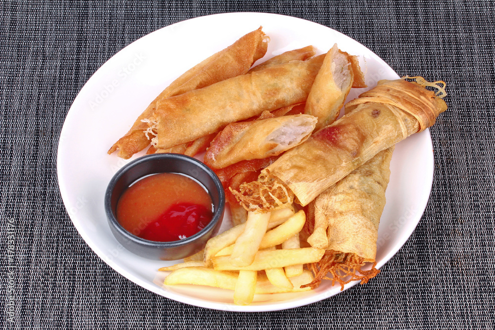 Deep fried spring roll,and frence fries sreved with tomato souce and ...