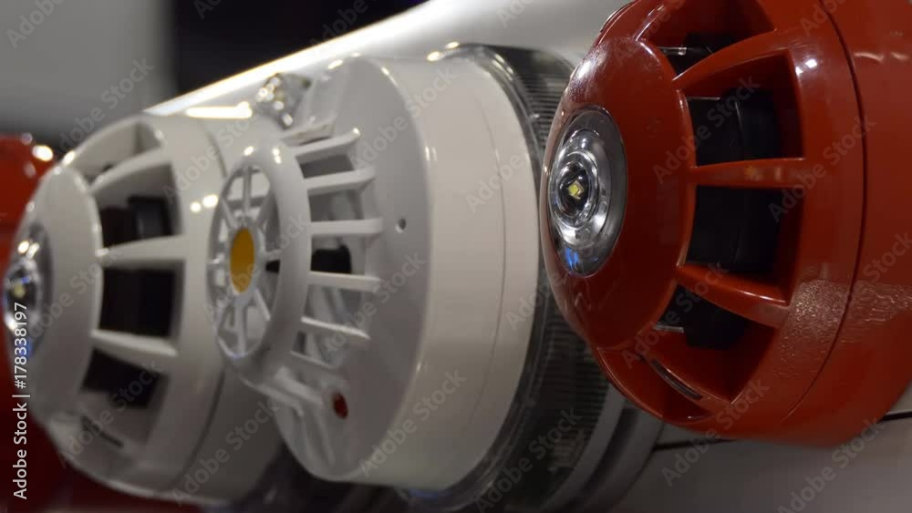 Close up of red and white fire and security alarm sounders with led ...