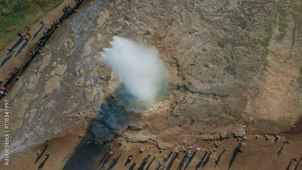An Unique over head aerial view of a Geyser blowing out sulfuric water ...