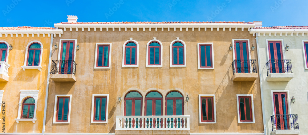 Vintage building with rectangle and radius top casement windows ...