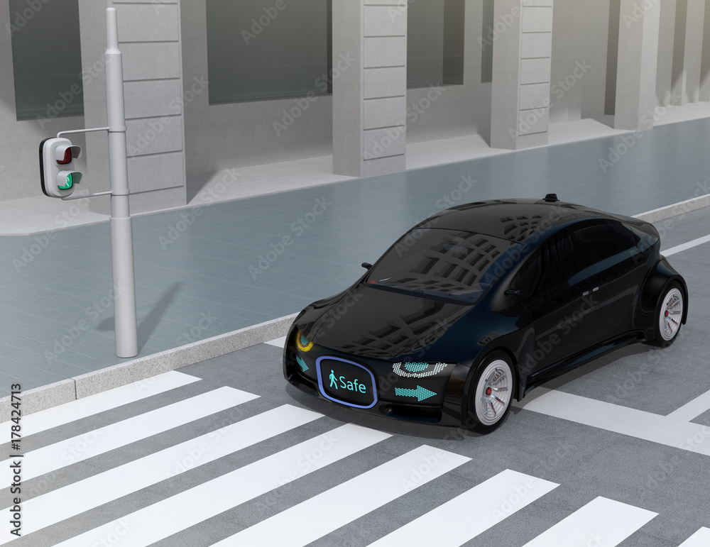 Black self-driving car's front grille showing digital signage for ...
