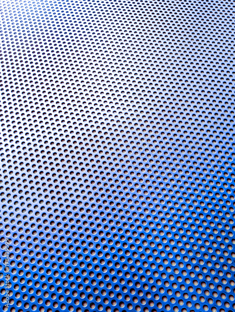 Blue perforated sheet, blue steel perforated plate in the background ...