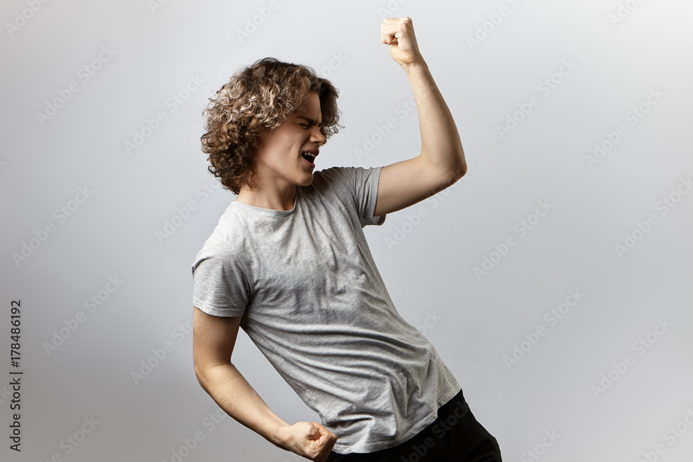 Success, good luck, joy and celebration. Attractive young man with ...