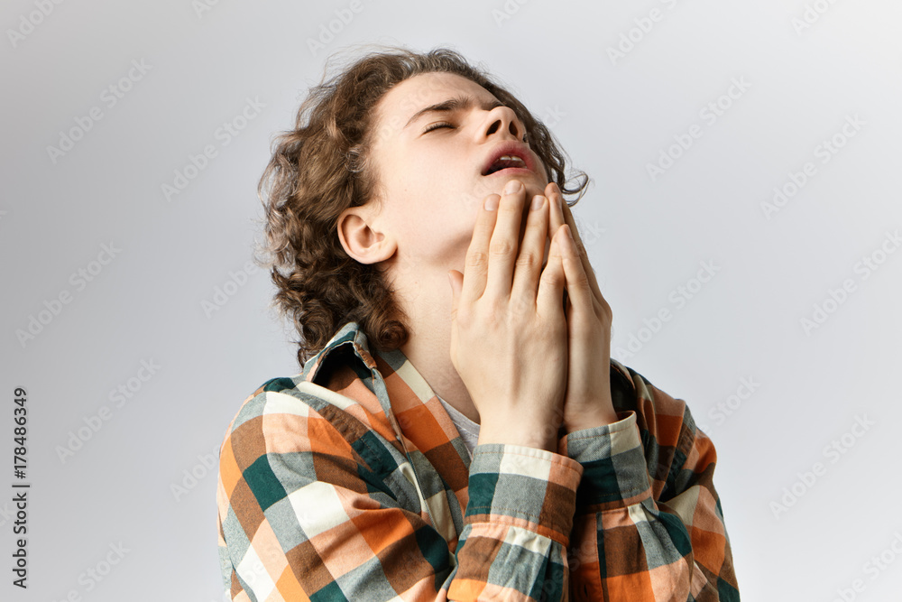 Unleashed emotions and true feelings. Stylish unhappy male teenager ...