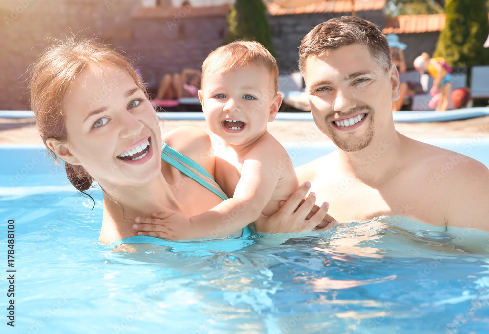 Child swimming lesson. Cute little boy learning to swim with parents in ...