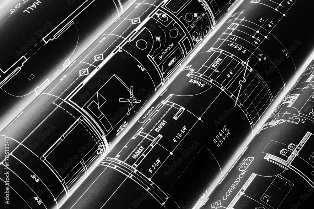 House blueprints, blue print style floor plans on architects desk ...