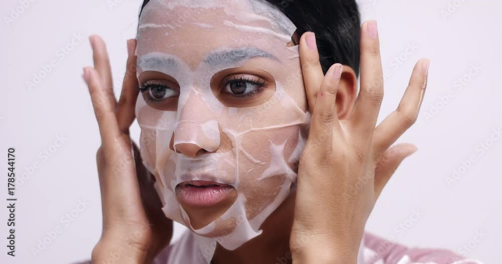 Attractive Middle Eastern woman with beautiful olive skin applying a ...