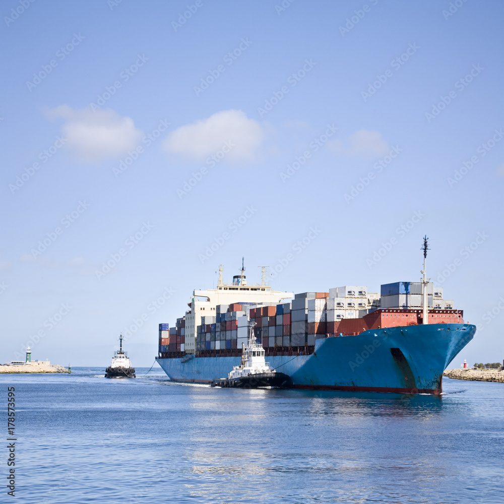 Massive Container Ship Entering River Mouth Assisted by Two Tugs Stock ...