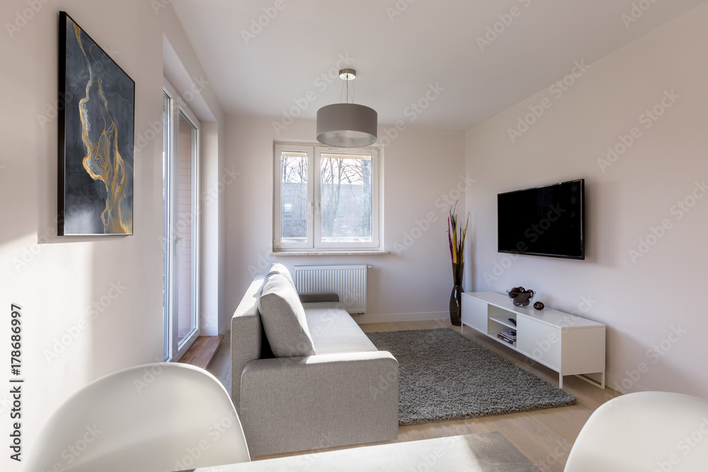 Simple living room with tv Stock Photo | Adobe Stock