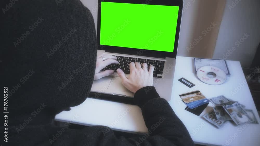 Vidéo Stock Criminal Hacker Cyber Attack, Green Screen Laptop. Hooded person typing in a green ...