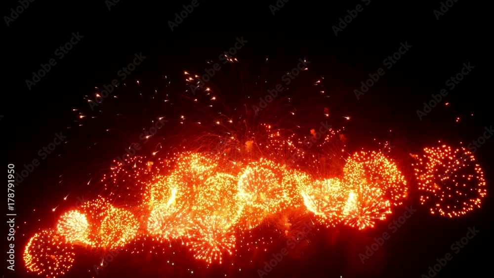 Firework display at night on black background. Bright red green yellow ...