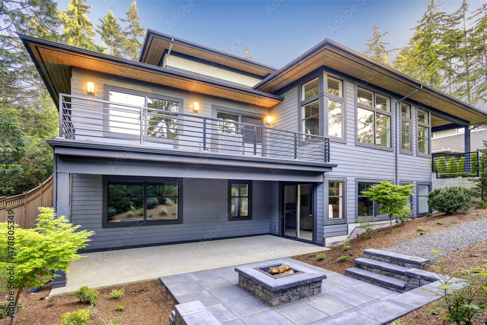 New modern home features a backyard with patio Stock Photo | Adobe Stock